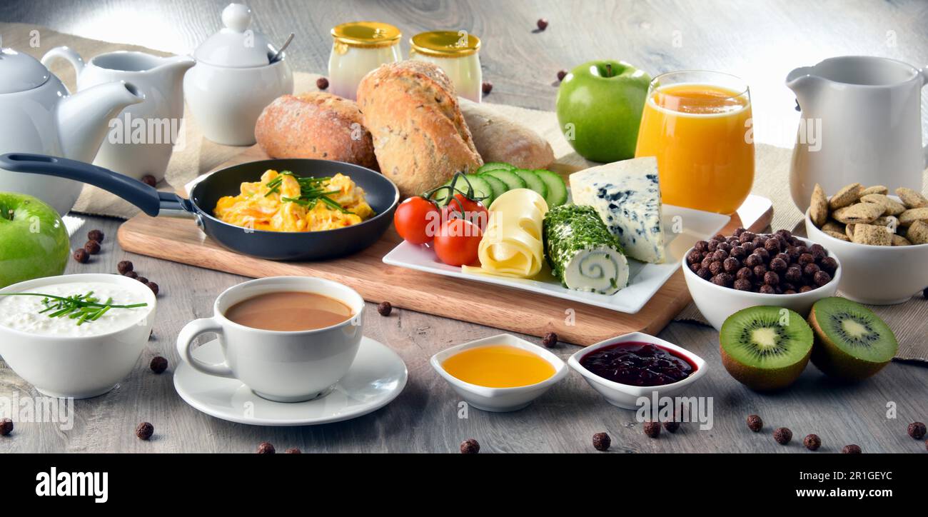 Breakfast served with coffee, orange juice, cheese, cereals and ...