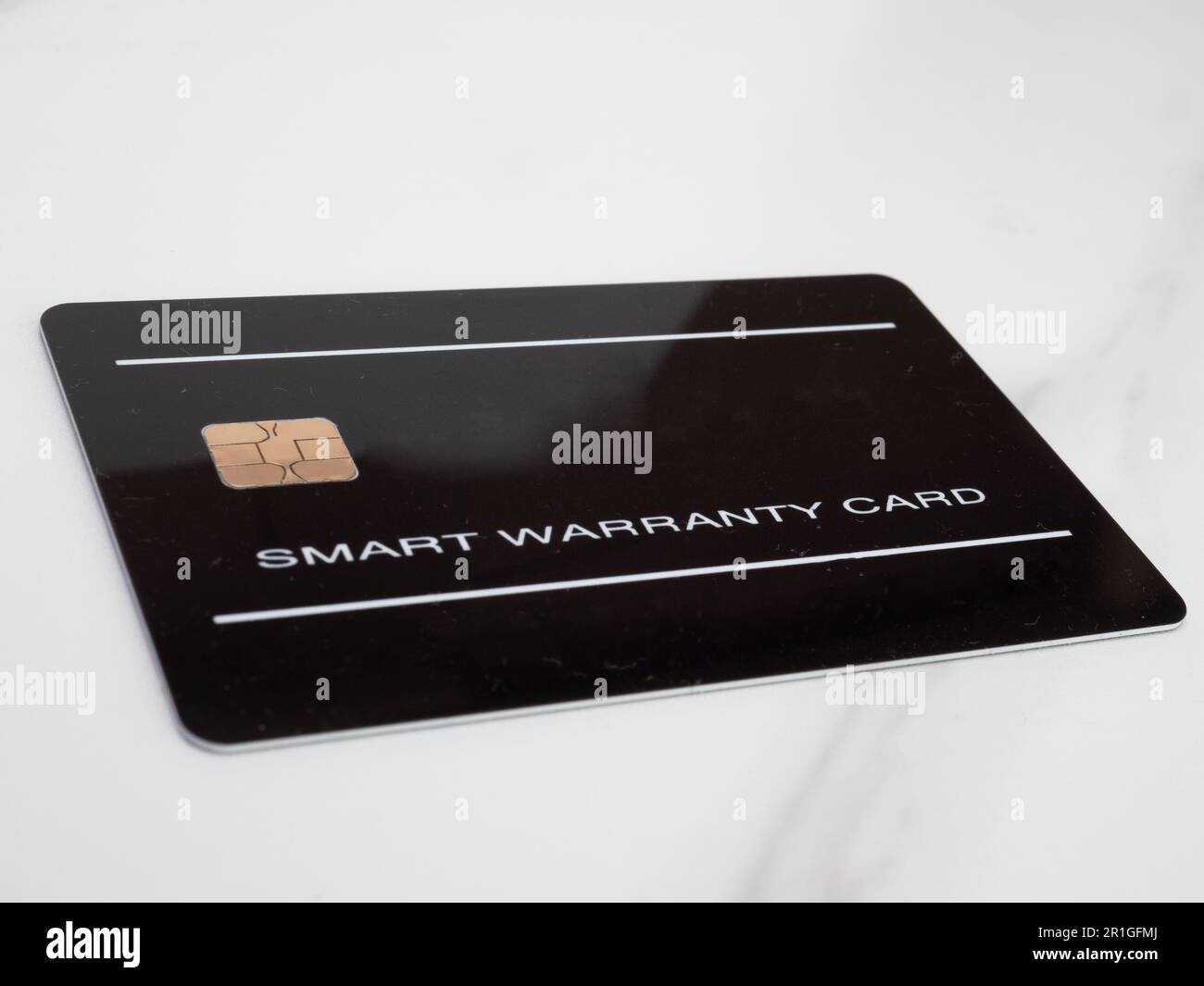Picture of a black warranty card on a white marble background Stock ...