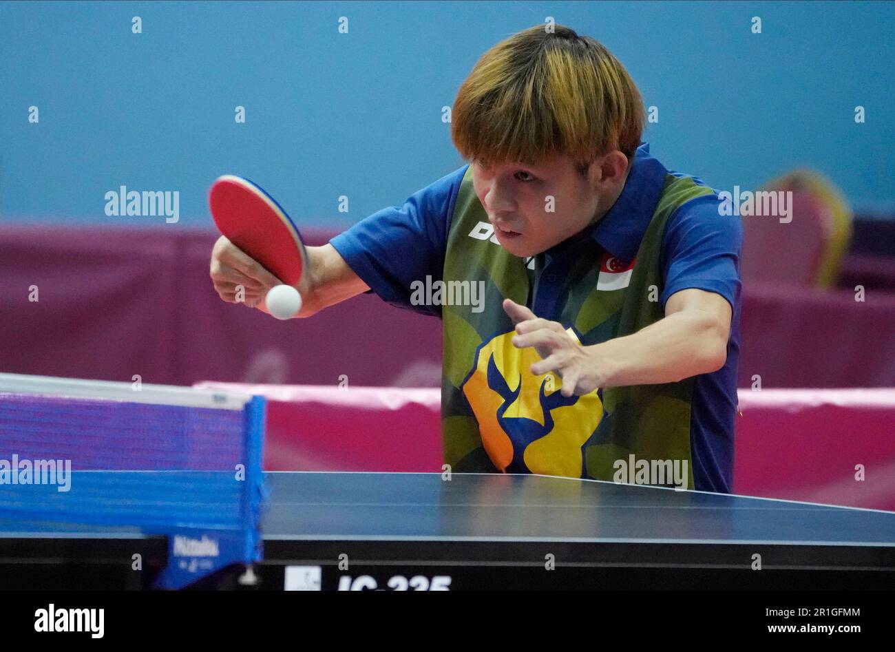 Singapore's Yong Isaac Quek returns a shot during men's doubles semi ...