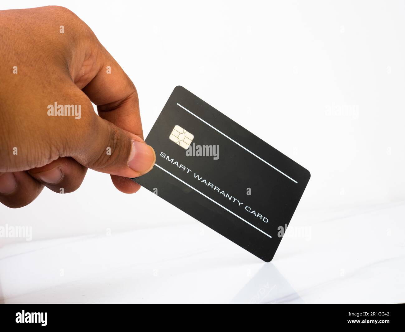 Picture of man holding a black warranty card Stock Photo - Alamy