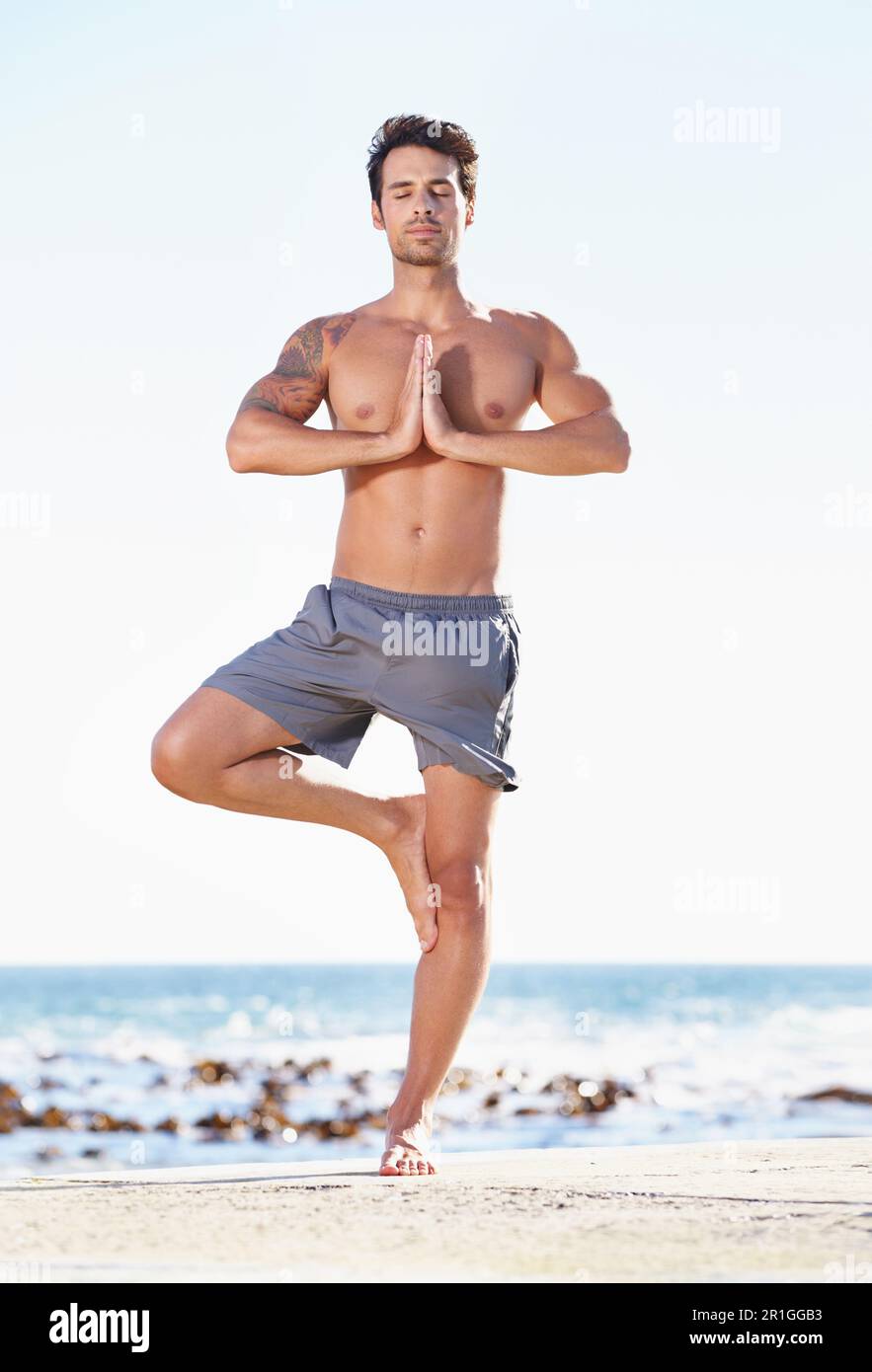 Fitness, man and yoga in meditation on beach for exercise, spiritual wellness or inner peace in ...
