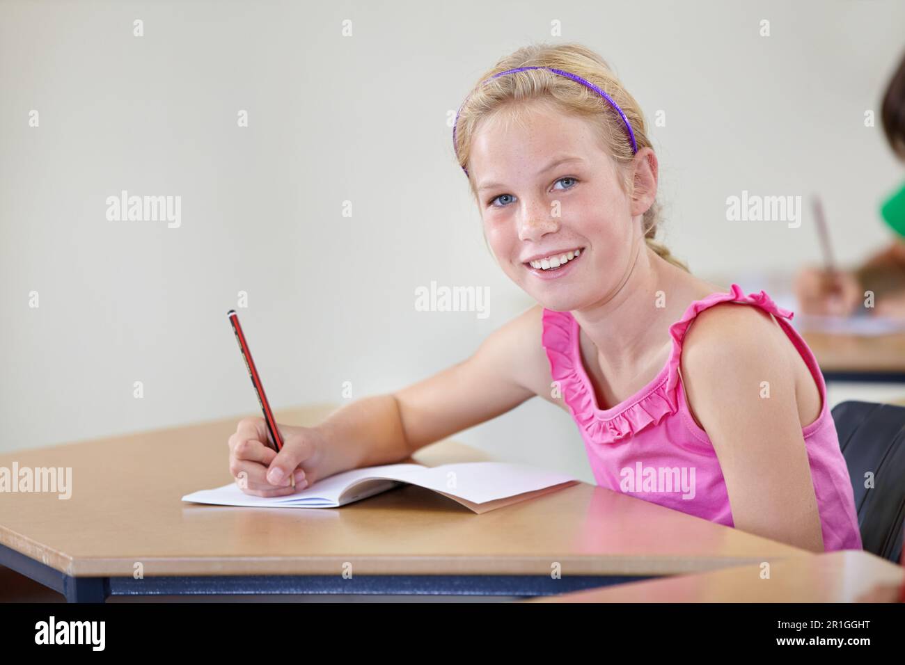 Portrait, child and smile of student learning in classroom for ...