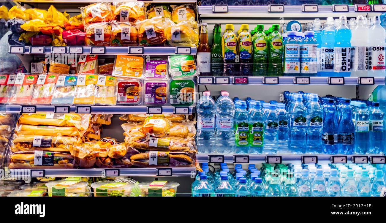 POZNAN, POL - MAR 12, 2022: Pre-packaged food and drinks displayed in a ...