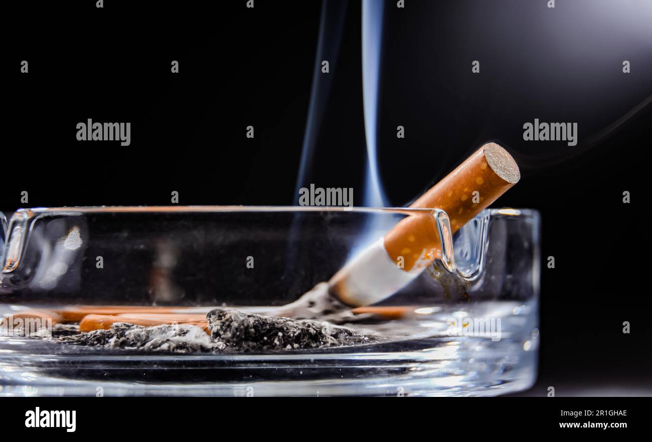 Composition with an ashtray and cigarettes Stock Photo - Alamy