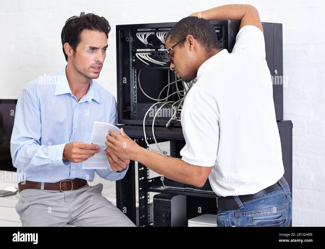 Server room, it support and error with a man engineer talking to a ...