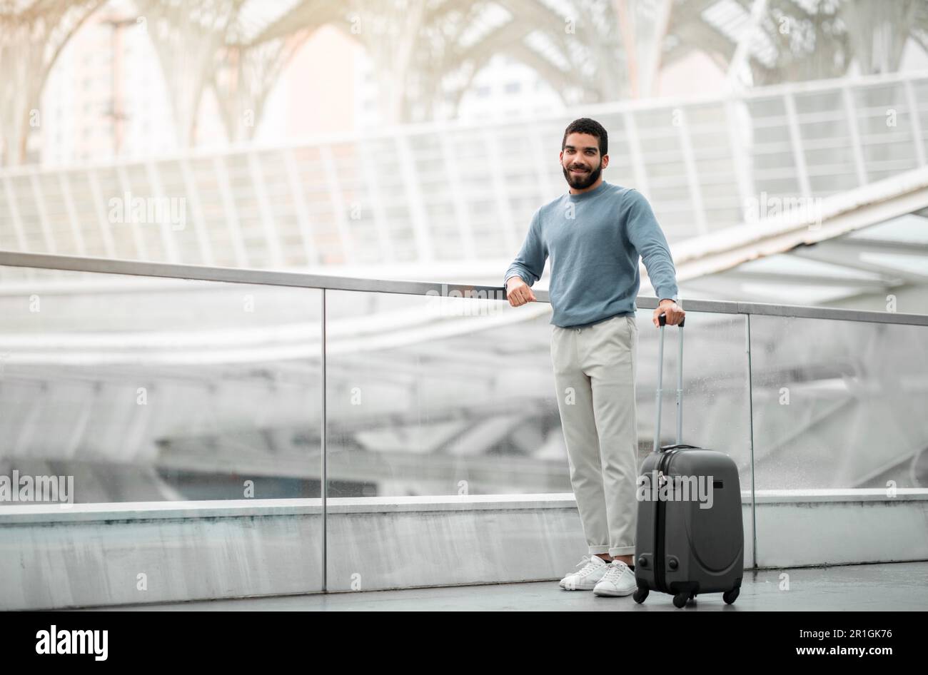 Arabic Tourist Man Posing With Suitcase At Airport, Full Length Stock ...