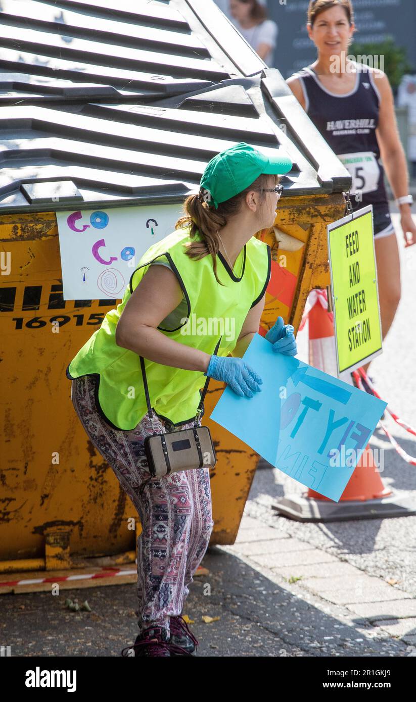 Helper at the Framlingham Flyers 10km road race putting up encouraging ...