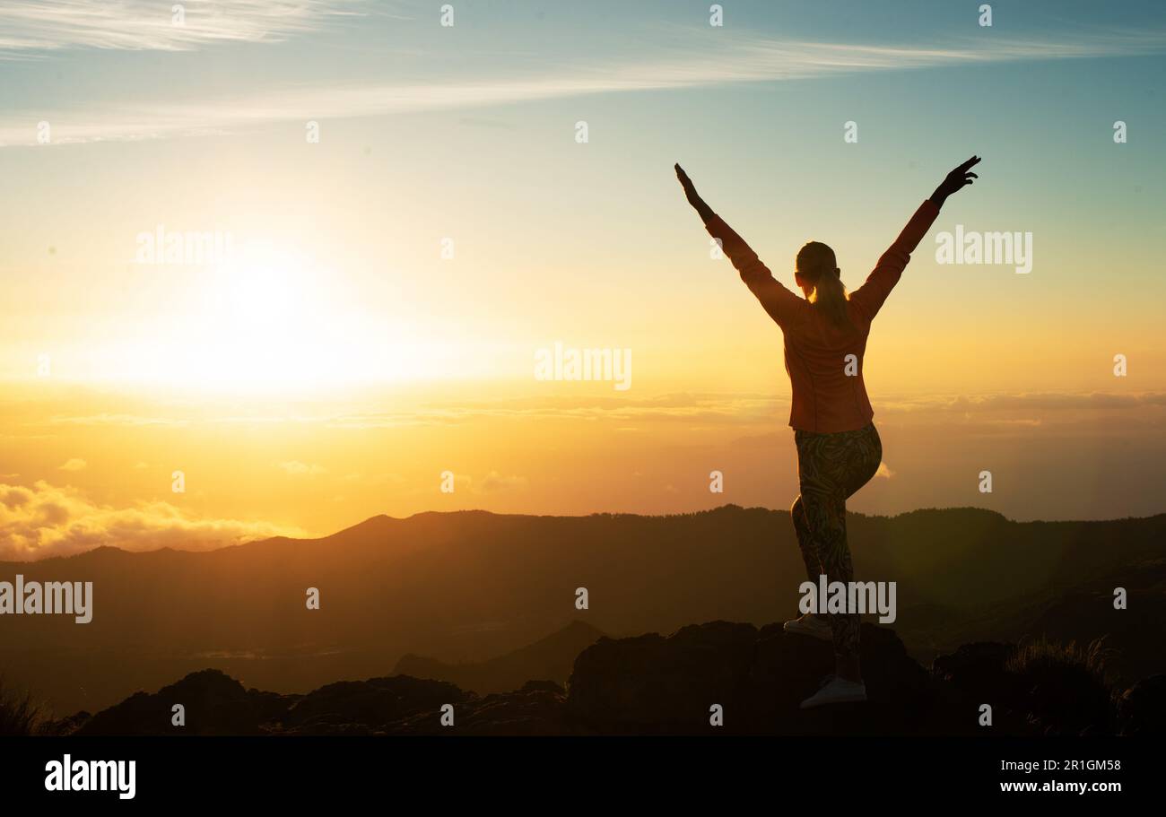 Female traveler raising arms hi-res stock photography and images - Alamy