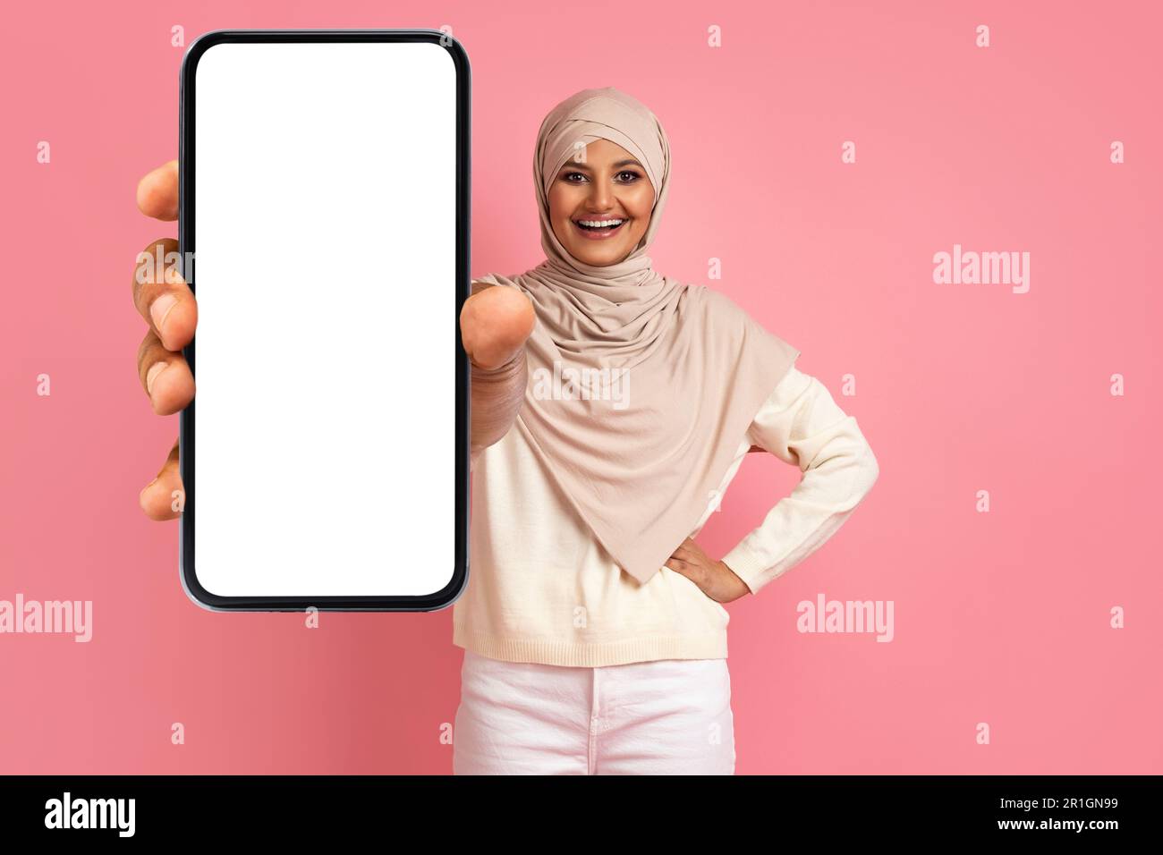 Mobile Ad. Muslim Female In Hijab Holding Big Smartphone With Blank ...