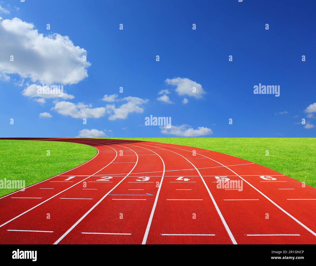 numbered runway at an athletics track with sky in background Stock ...