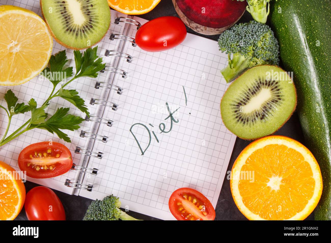 Word diet written in notepad and fresh ripe fruits with vegetables ...