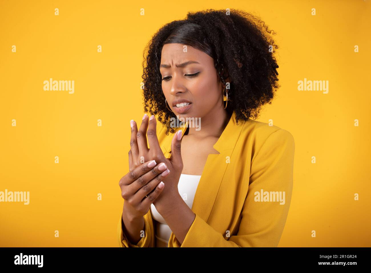 Numbness of the limbs. Black lady suffering from pain in the hand, palm ...