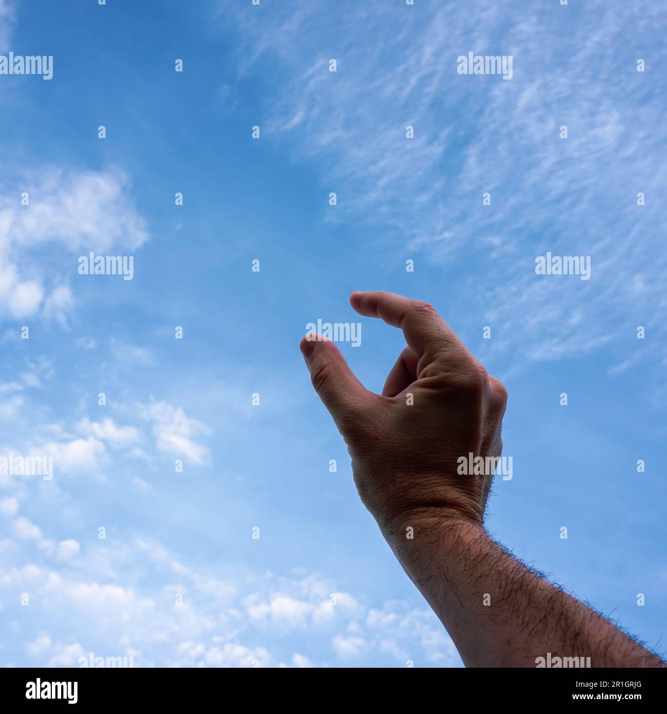 hand up gesturing in the blue sky, feelings and emotions Stock Photo ...