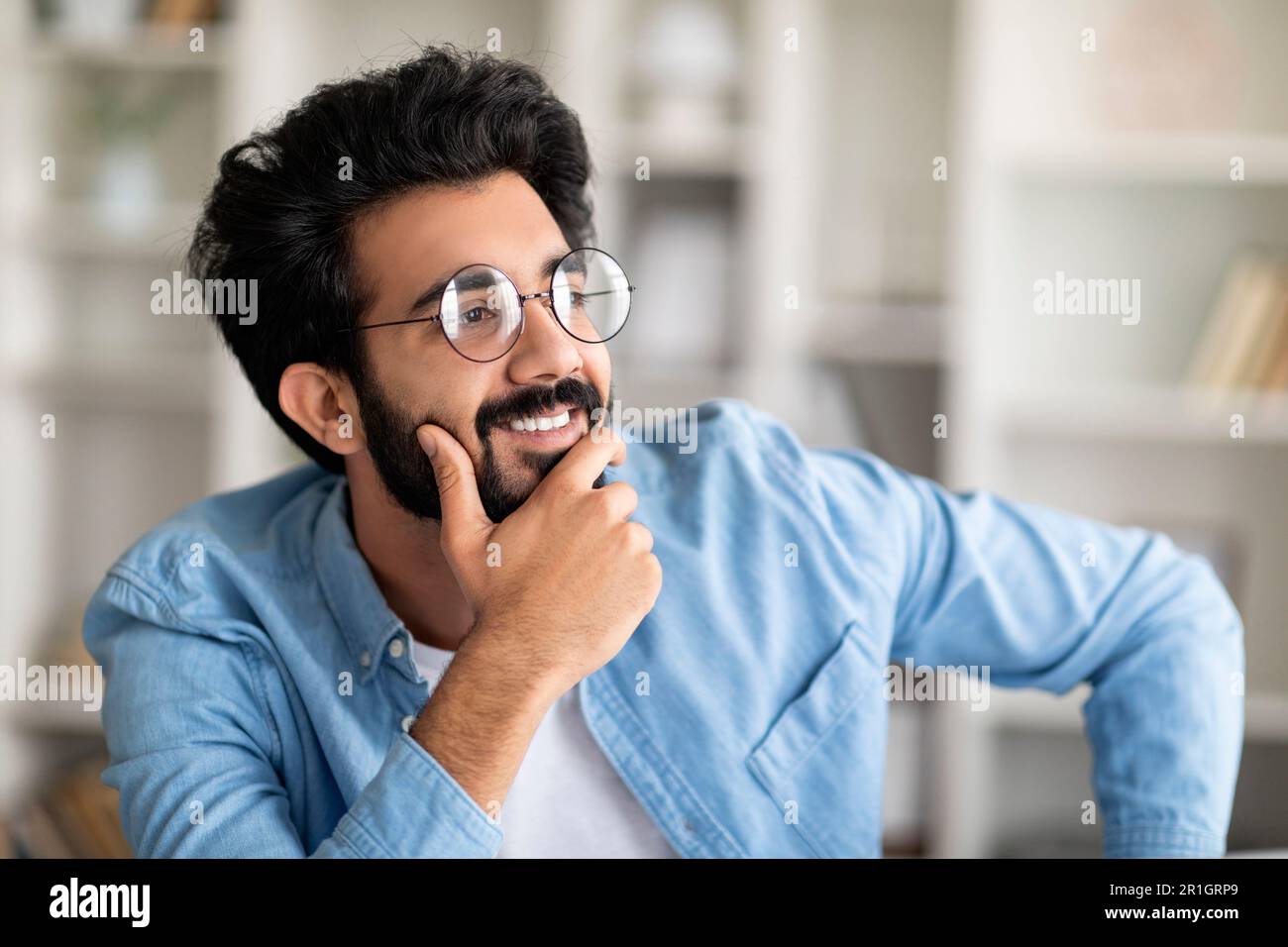 Portrait Of Pensive Smiling Indian Man Wearing Eyeglasses Posing In ... Portrait Of Pensive Smiling Indian Man Wearing Eyeglasses Posing In ...