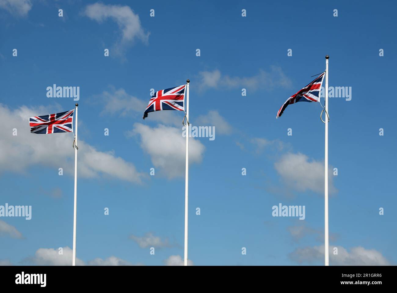 Three Union Jack flags on poles on Plymouth Hoe, promenade. Also known ...