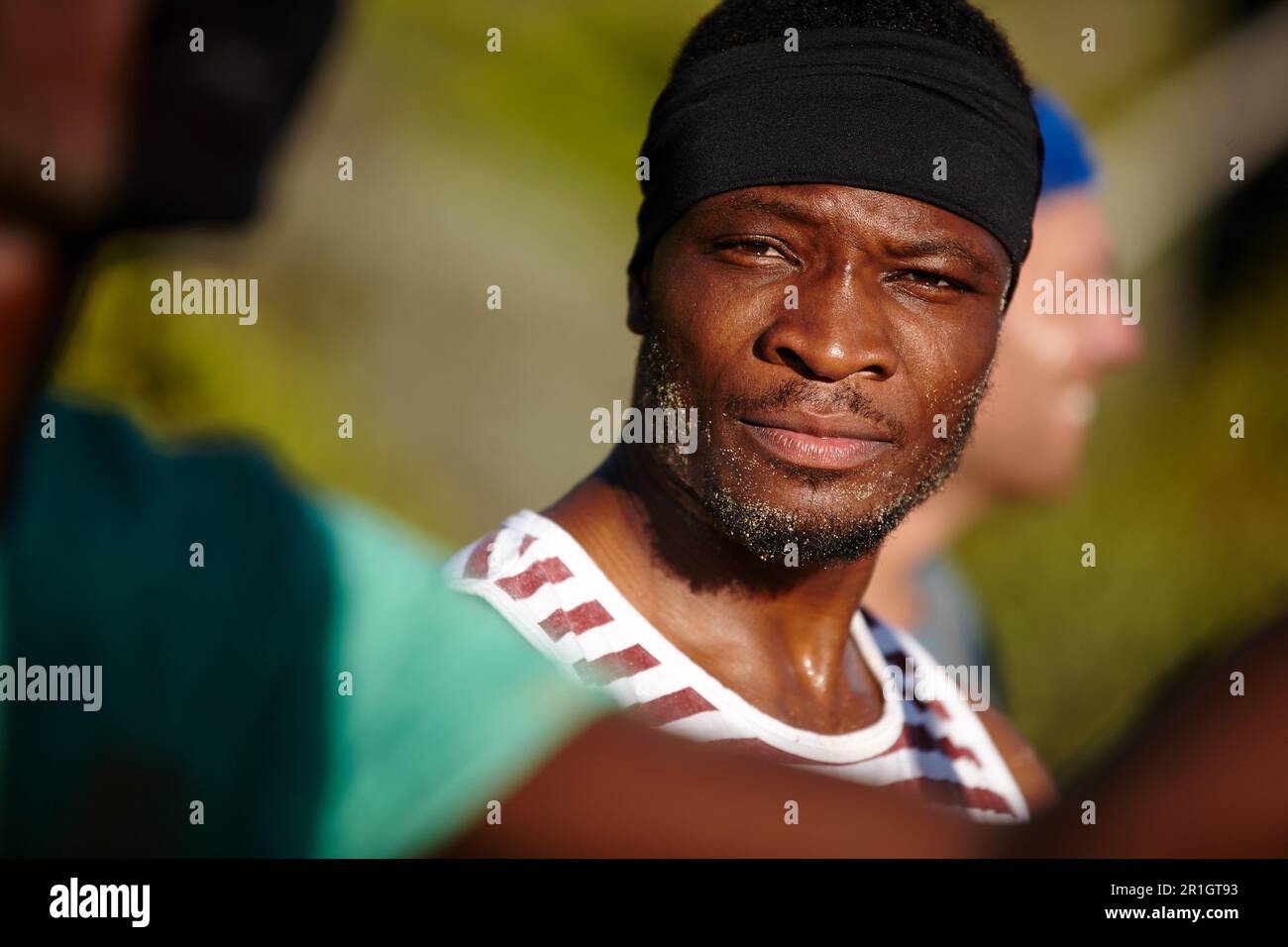 Strong like bull. a young man at bootcamp with his friends Stock Photo ...