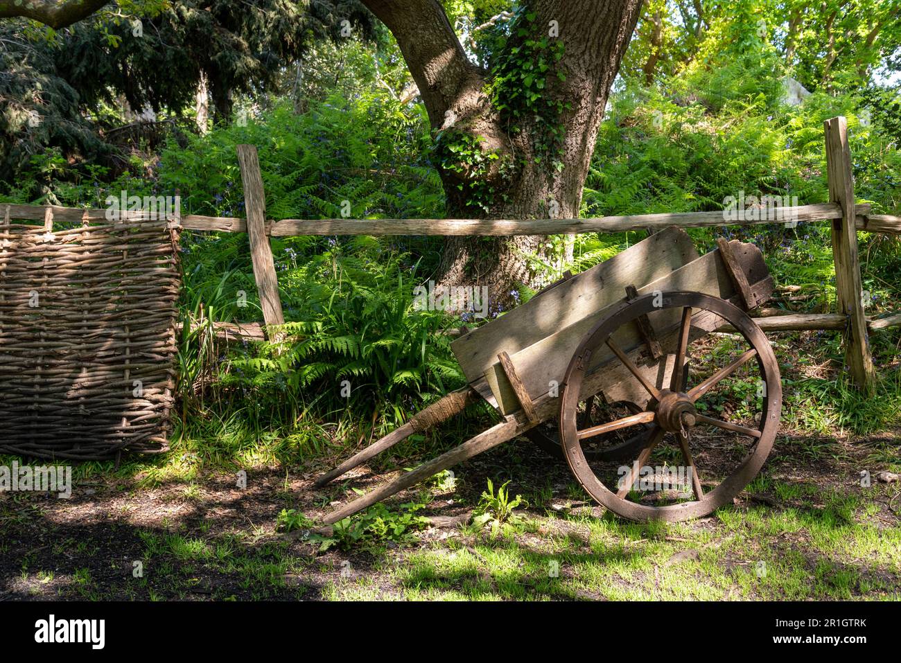 Timeless image of an old wooden hand cart with metal rimmed wheels ...