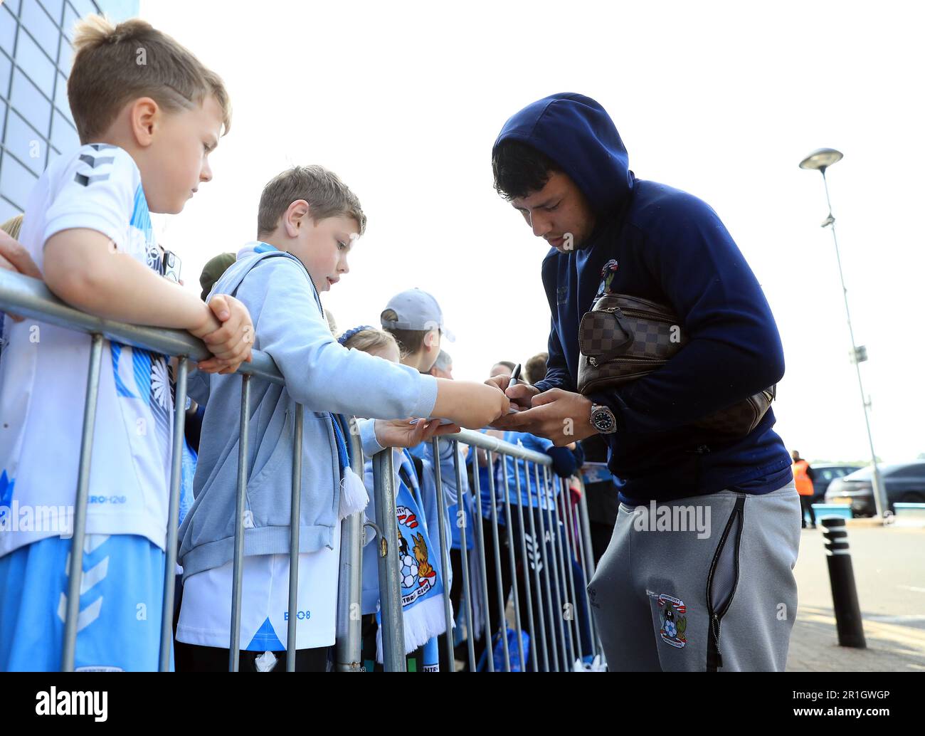 Coventry City's Gustavo Hamer signs autographs as he arrives at the ...