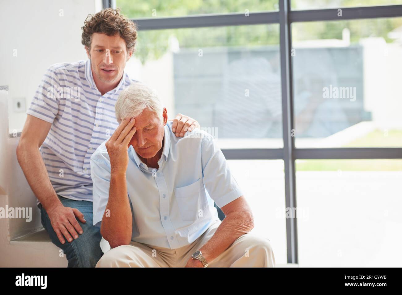 Whats the matter, Dad. a man offering support to his father Stock Photo ...