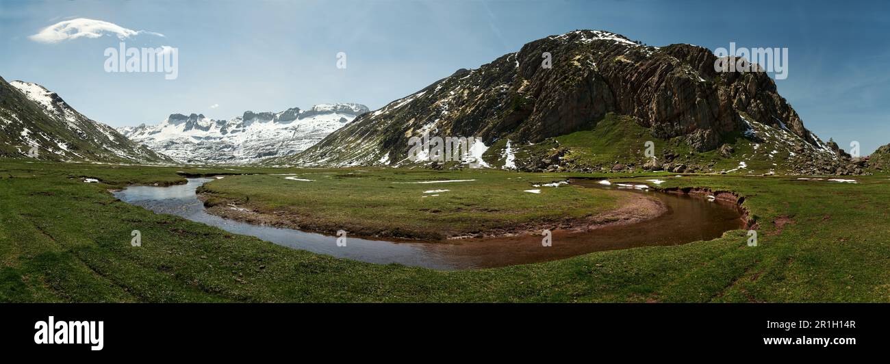 panoramic view of a Pyrenean valley, a river of crystalline waters can ...