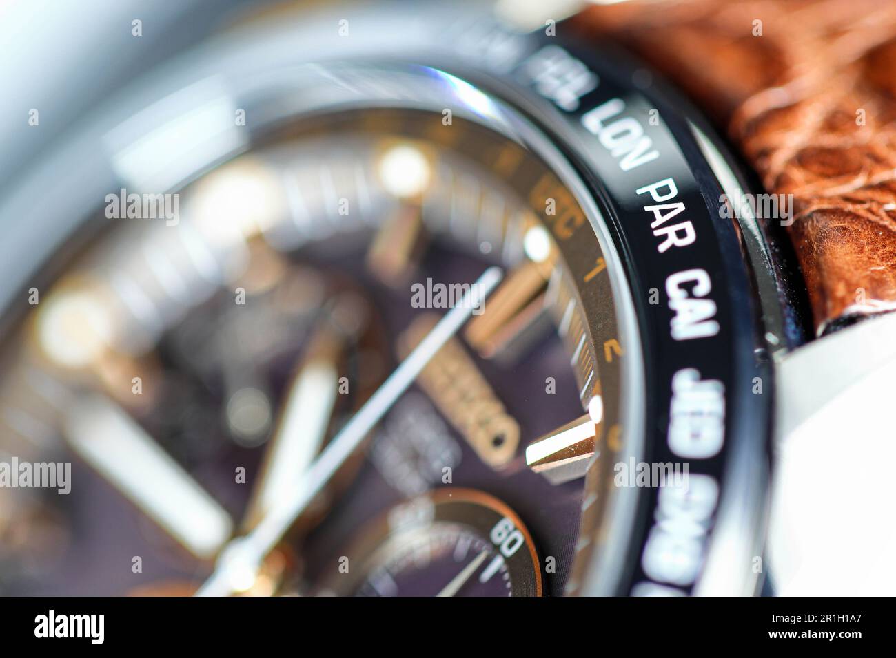 close up shallow focus Time zone cities code on luxury world time watch ...