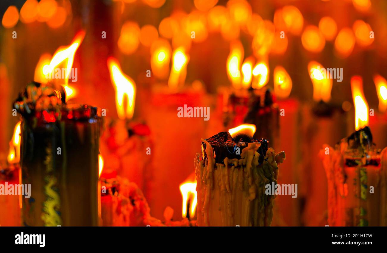 yellow wax chinese candles with lucky symbol burning red Chinese candle ...