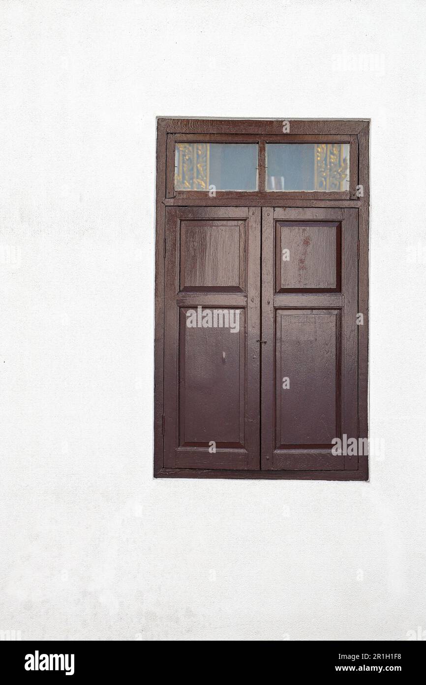 dusty white ancient building facade with beautiful dark brown wooden ...