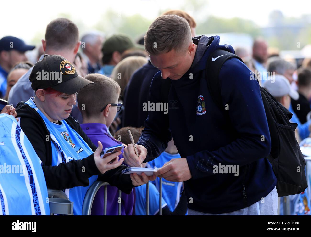Coventry City goalkeeper Simon Moore signs an autograph prior to the Sky Bet Championship play ...