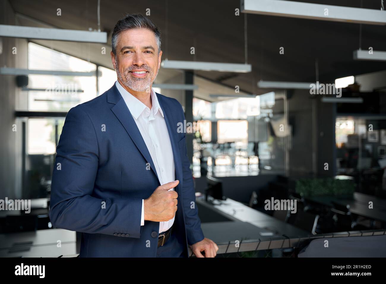 Happy middle aged business man ceo executive standing in office ...