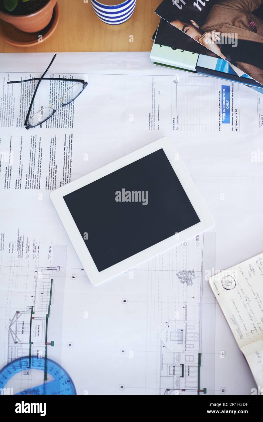 Tablet, blueprint and mockup on office desk above for architecture ...