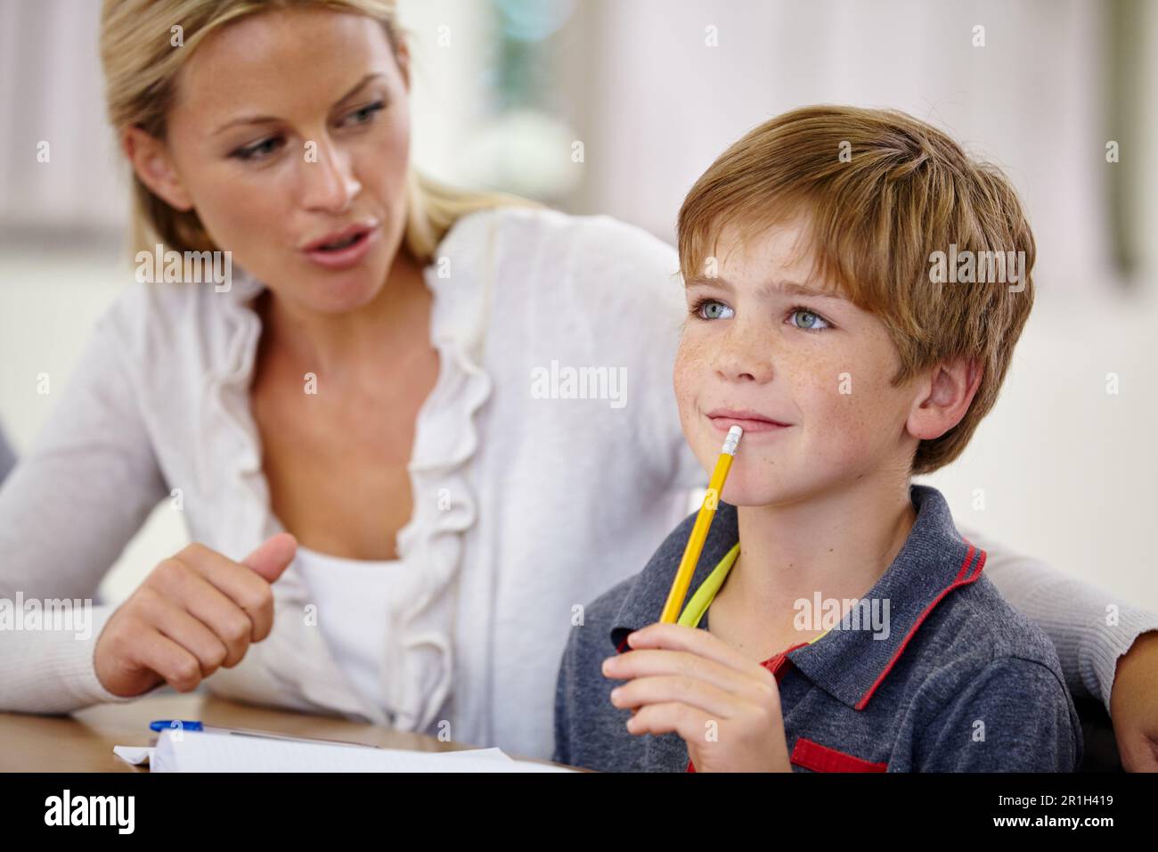 School, woman helping student with homework or question and in ...