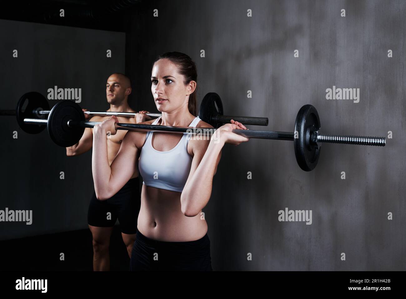 Fitness, people and weightlifting with barbell for serious exercise ...