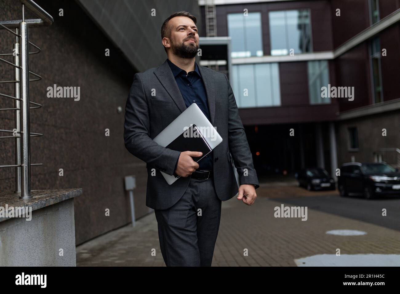 successful male architect with documents on the background of the built ...