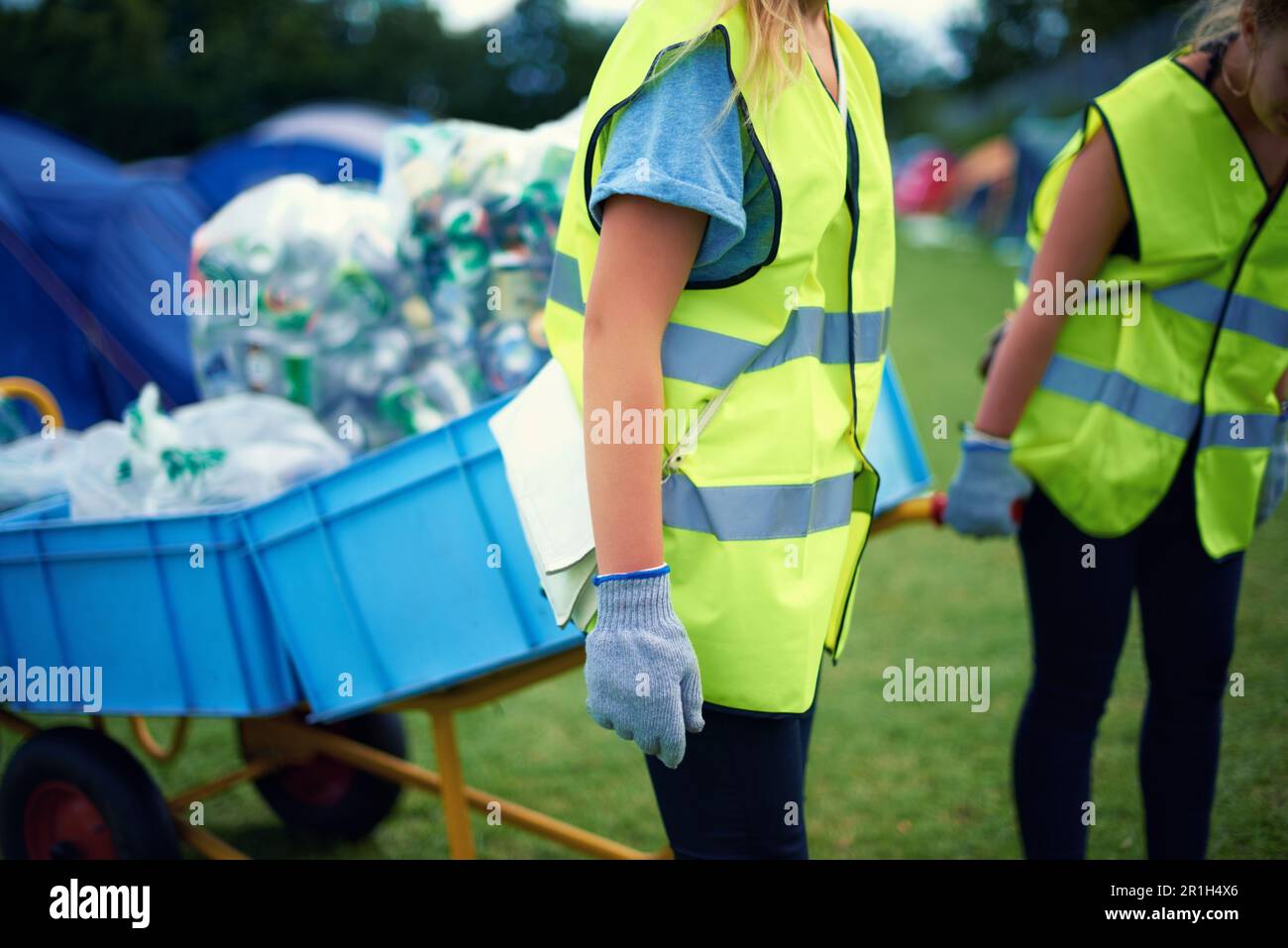 Recycling, community service hands and volunteer work outdoor with cans ...