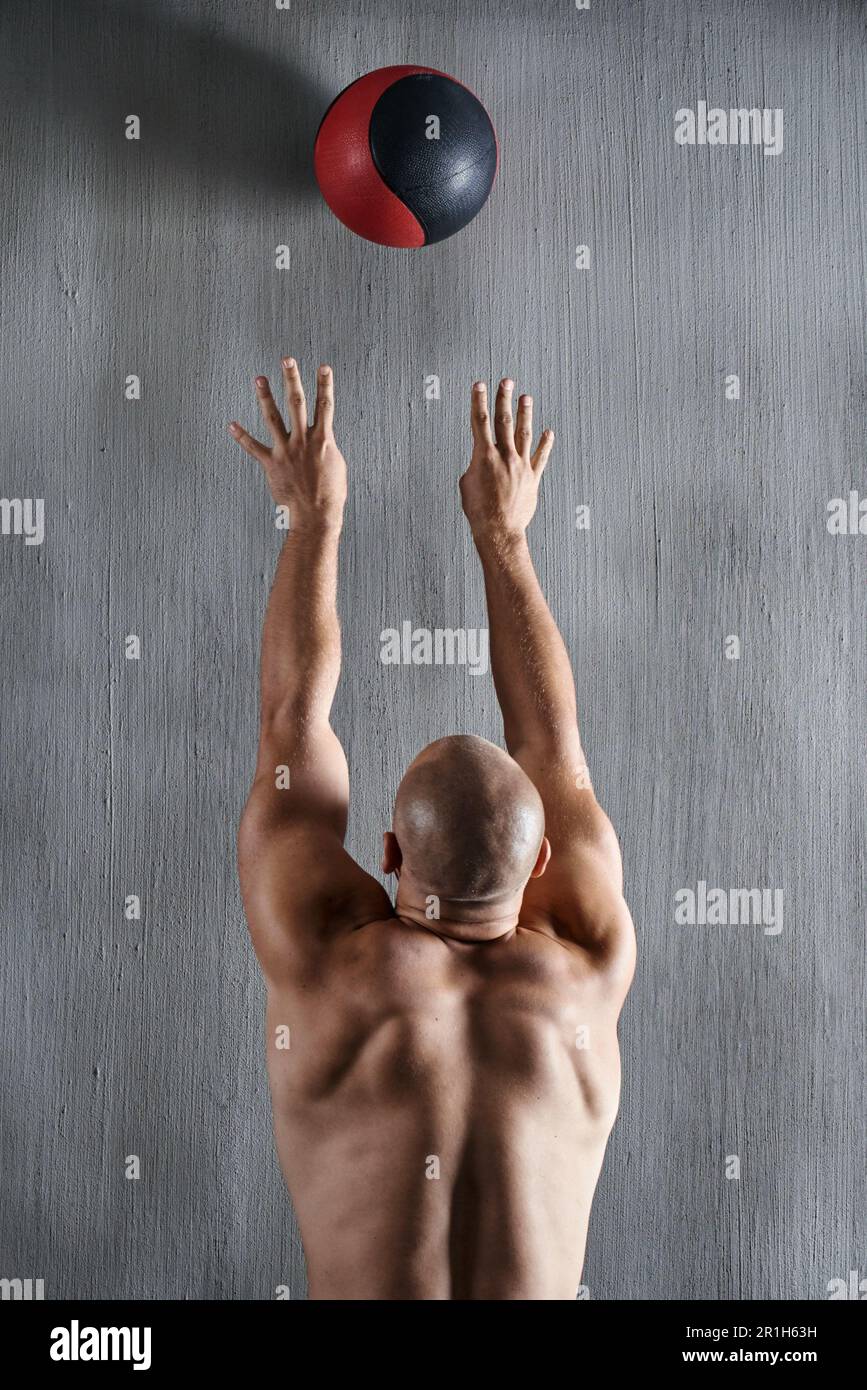 Fitness, wall and man throw medicine ball strength workout ...