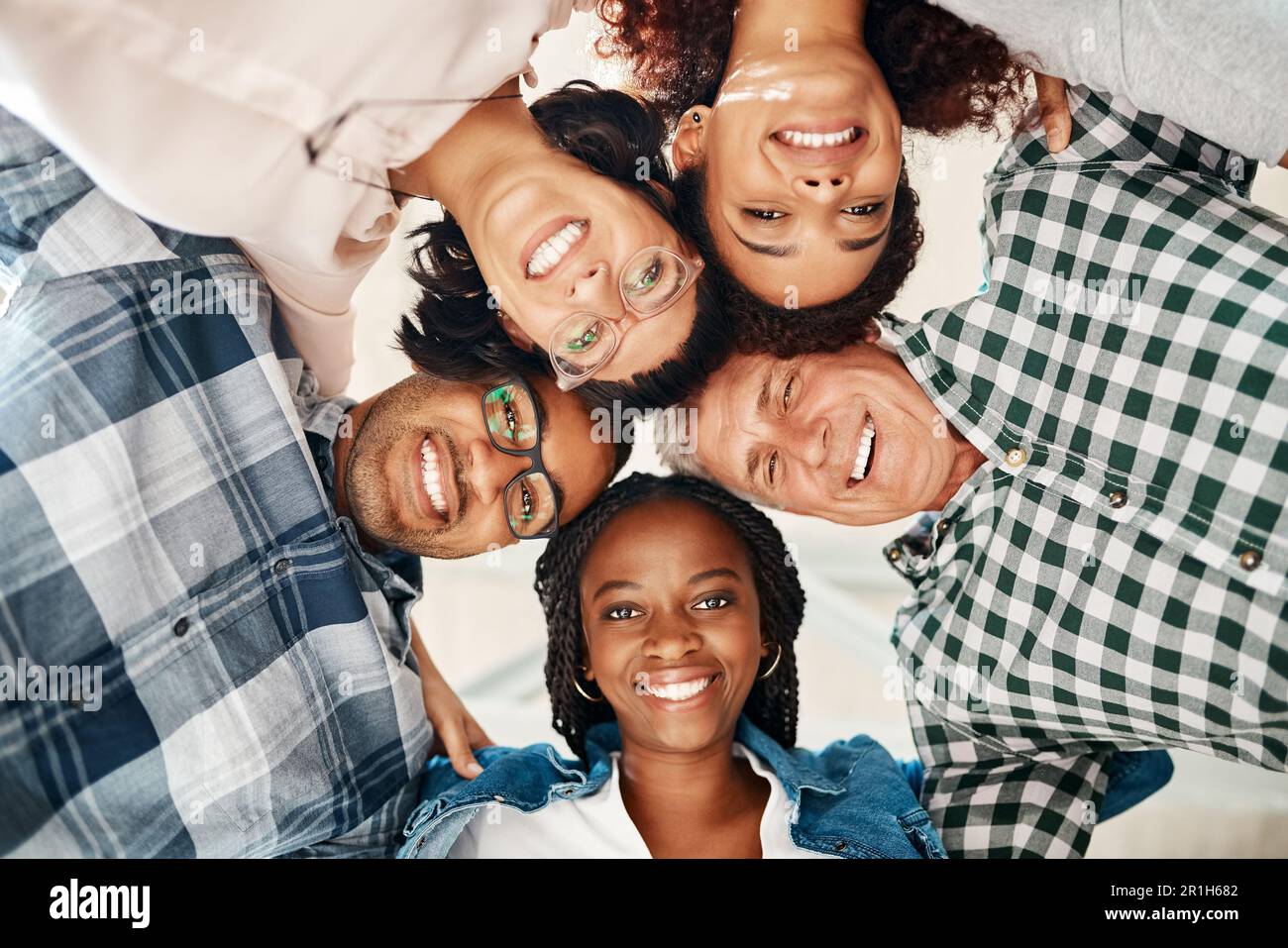 Stick together, succeed together. Low angle portrait of a team of ...