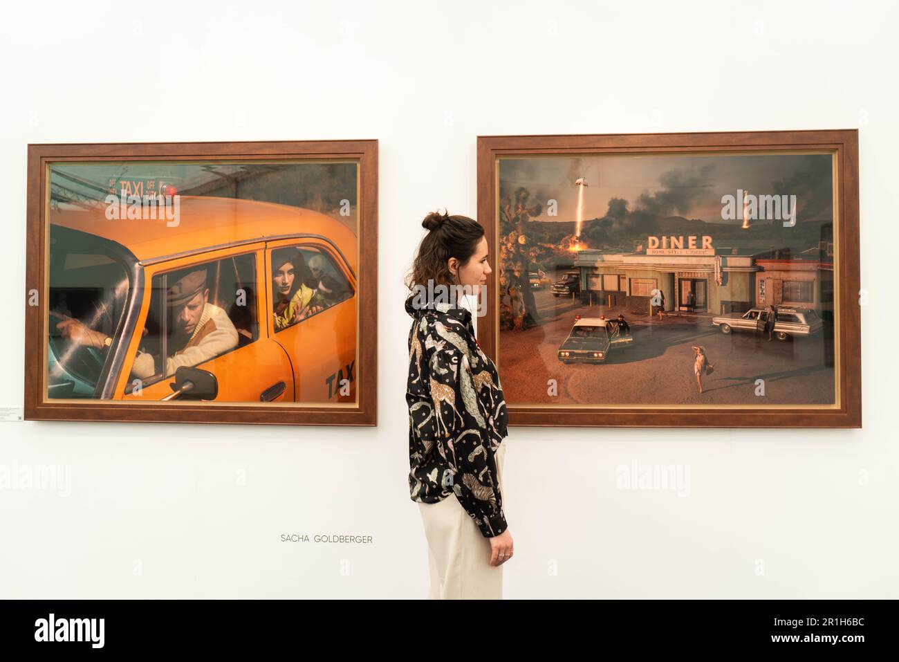 London UK. 14 May 2023. A gallery member with works by Sacha Goldberger ...