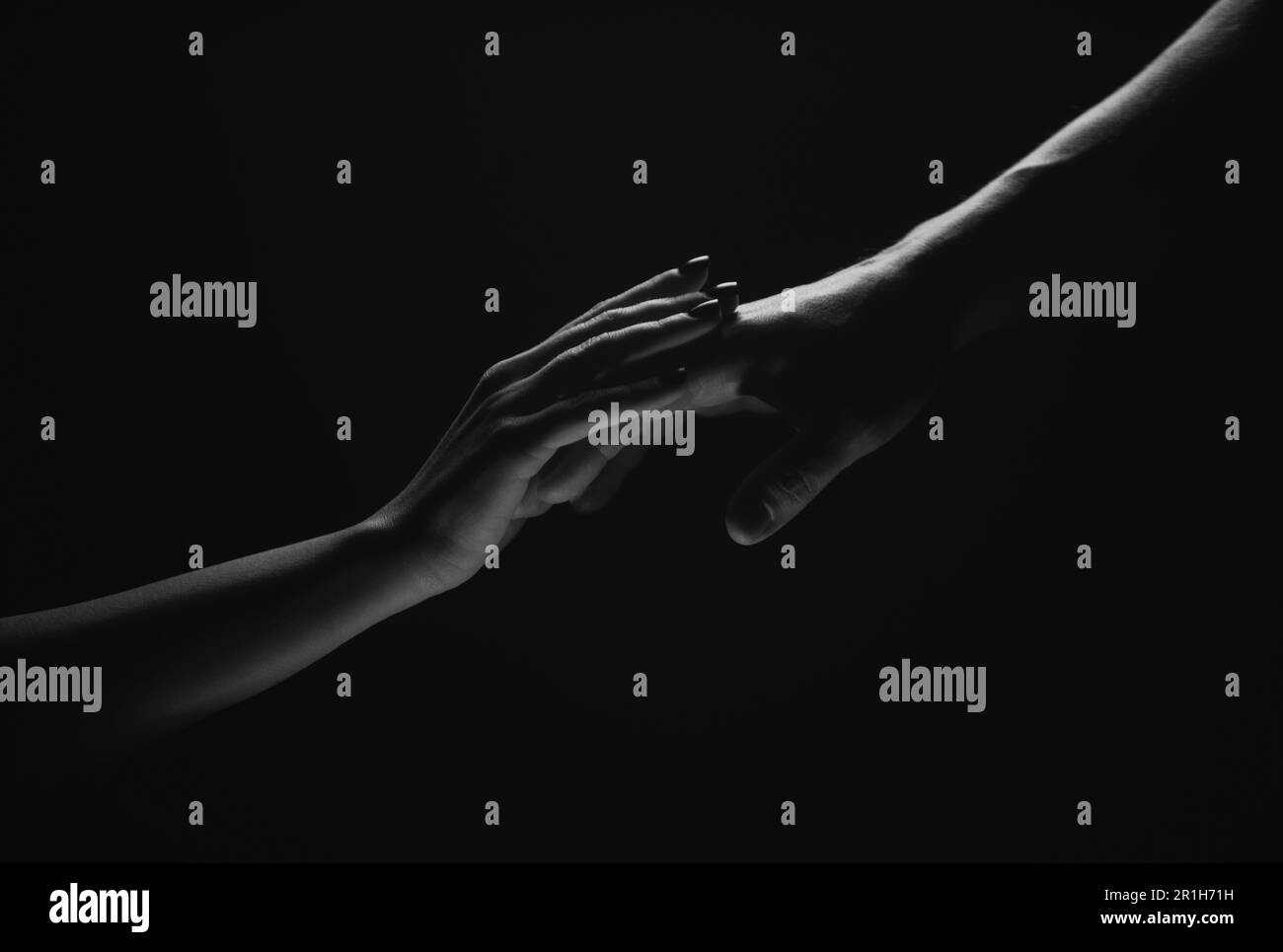 Two hands at the moment of farewell. The holding hands of relations ...