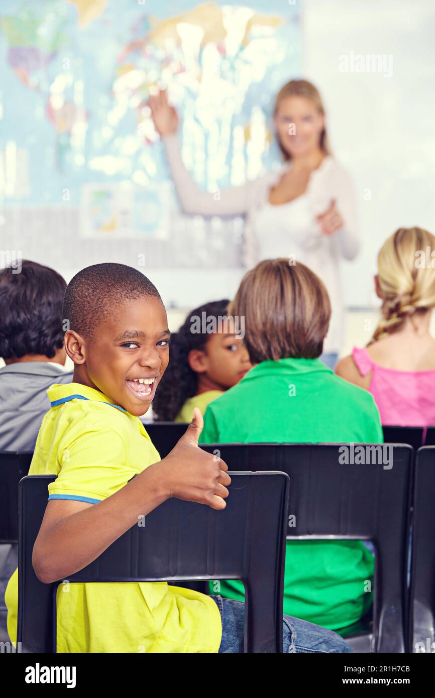 Portrait, black child and thumbs up of student in class, elementary ...