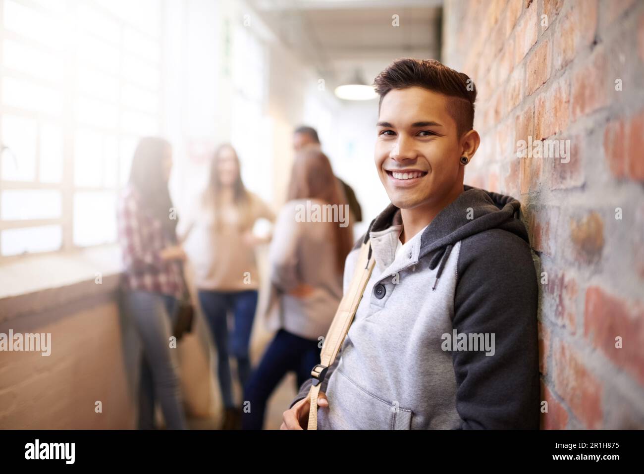 Education, smile and portrait of man in college hallway for studying ...