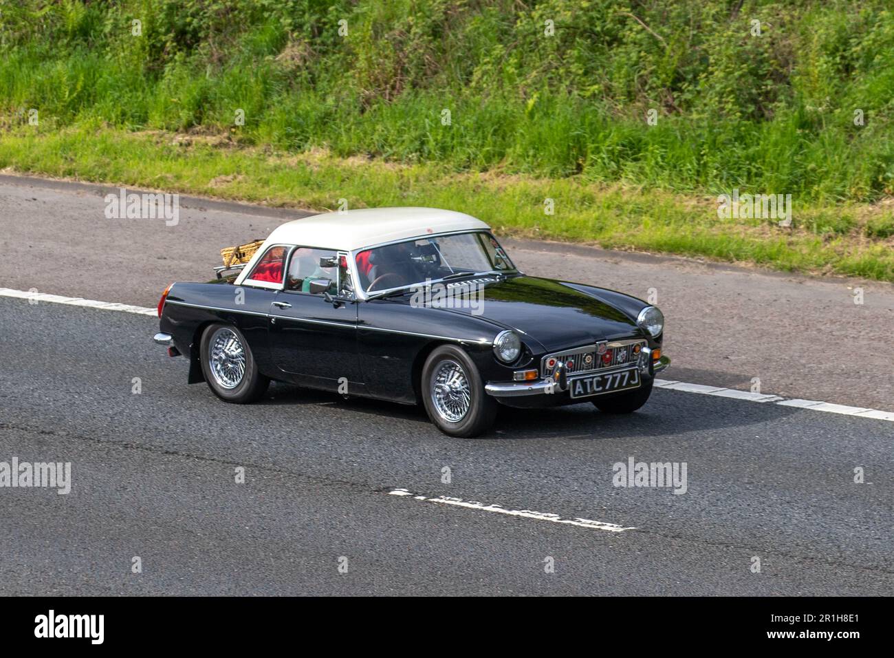 1970 70s seventies MG Roadster Black, Petrol car 1950 cc; travelling on ...
