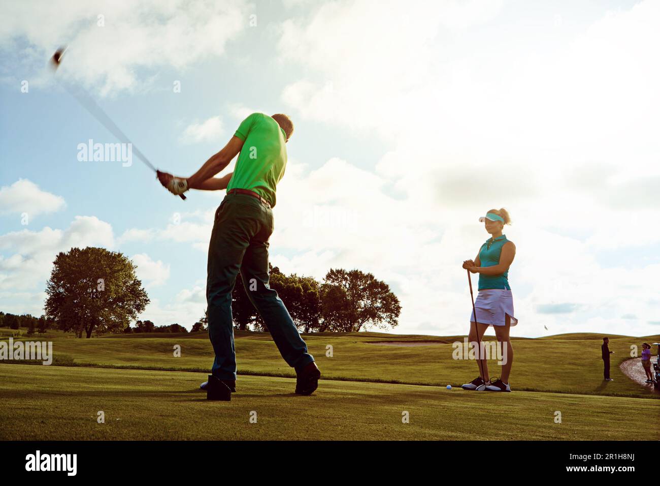 Every swing makes him a better player. a couple playing golf together ...