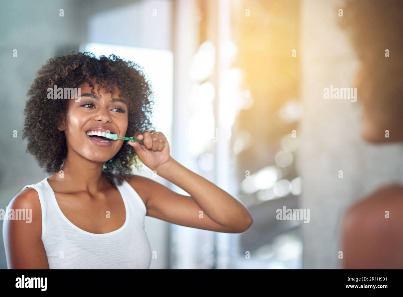 Mirror, dental and black woman brushing teeth, fresh breath and oral ...