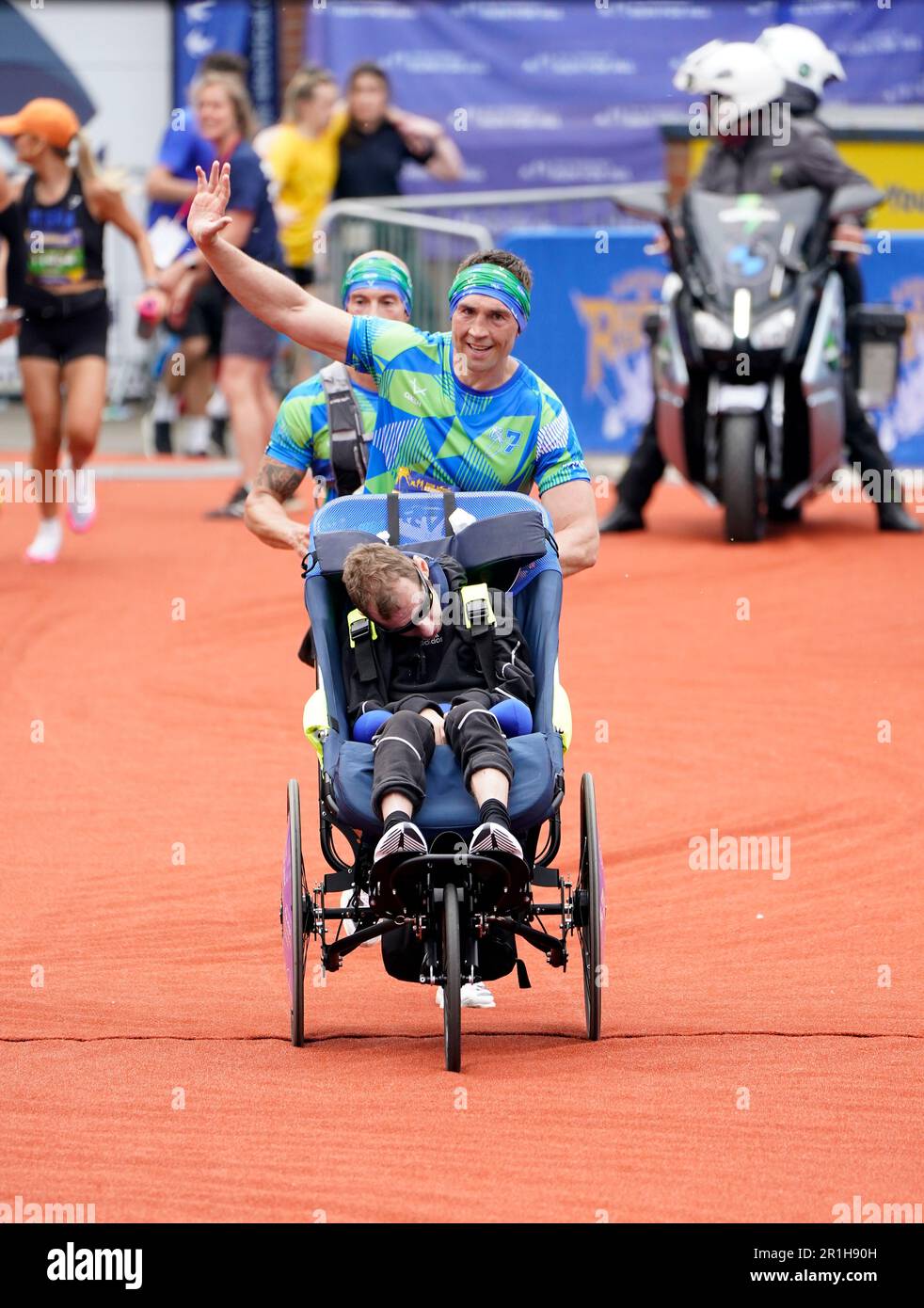 Rob Burrow and Kevin Sinfield cross the finish line of the 2023 Rob ...
