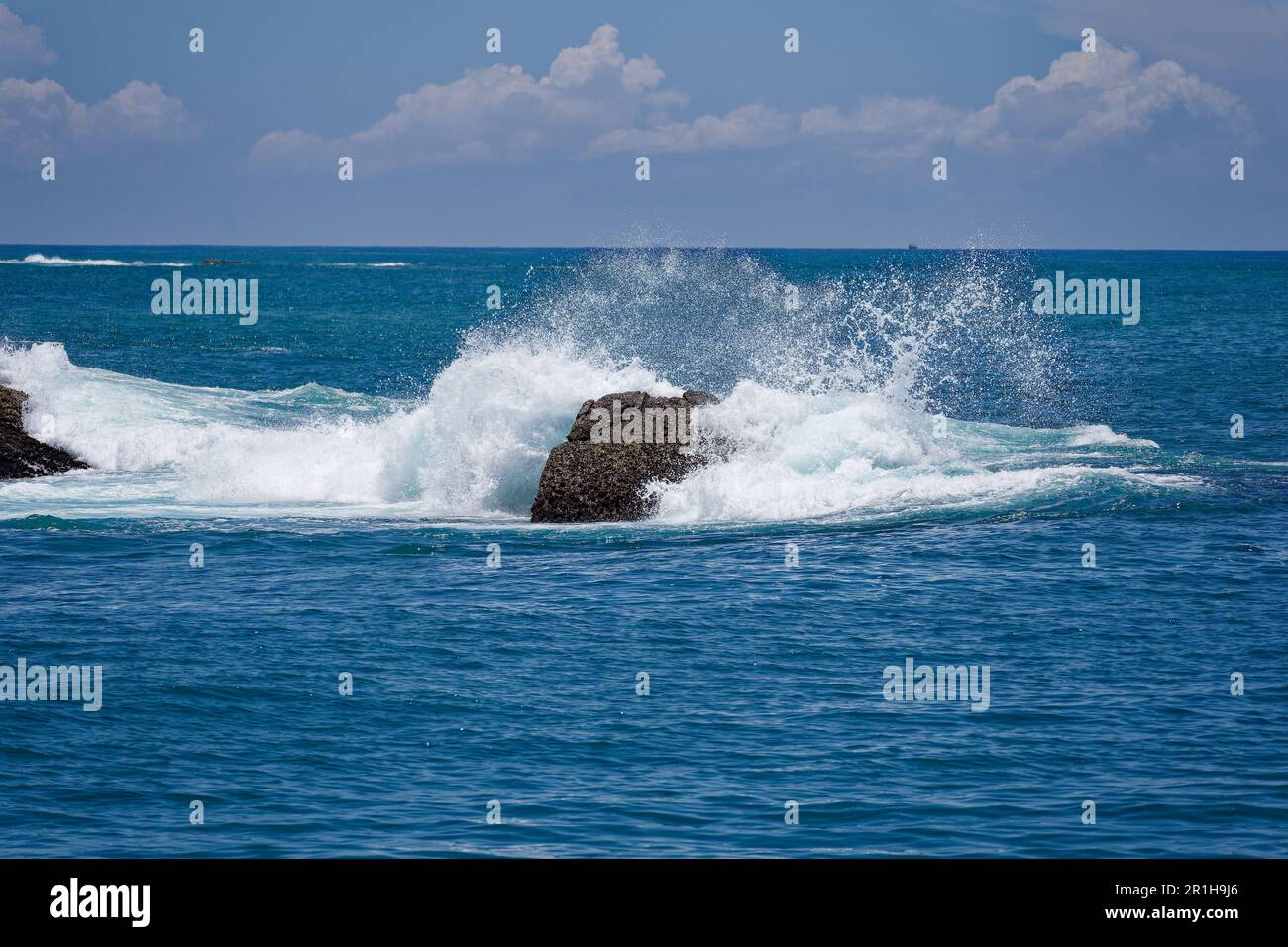 Wave splashing over rock in the Indian Ocean in Sri Lanka Stock Photo ...