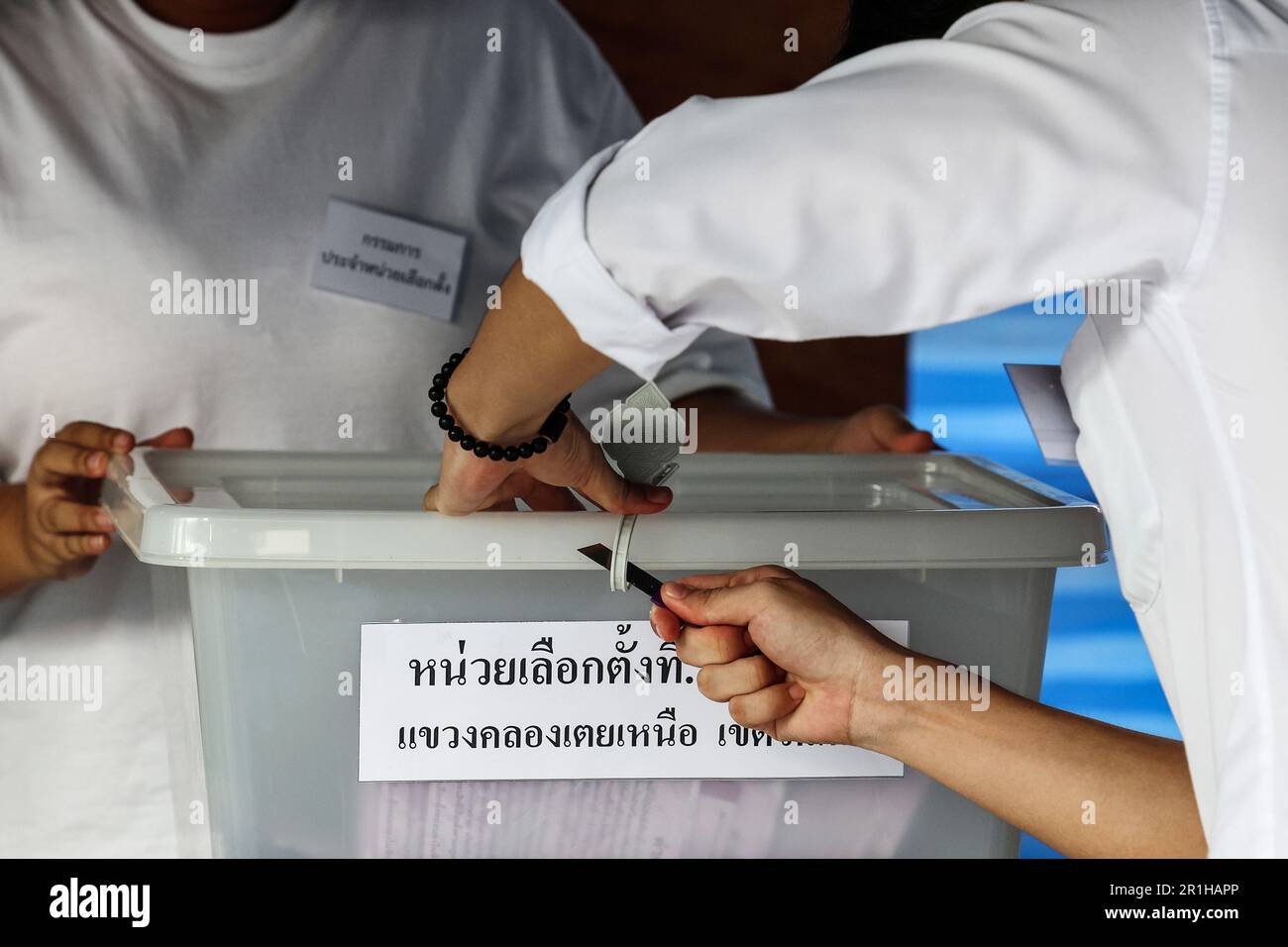 Bangkok, Thailand. 14th May, 2023. An electoral official opens a ballot ...