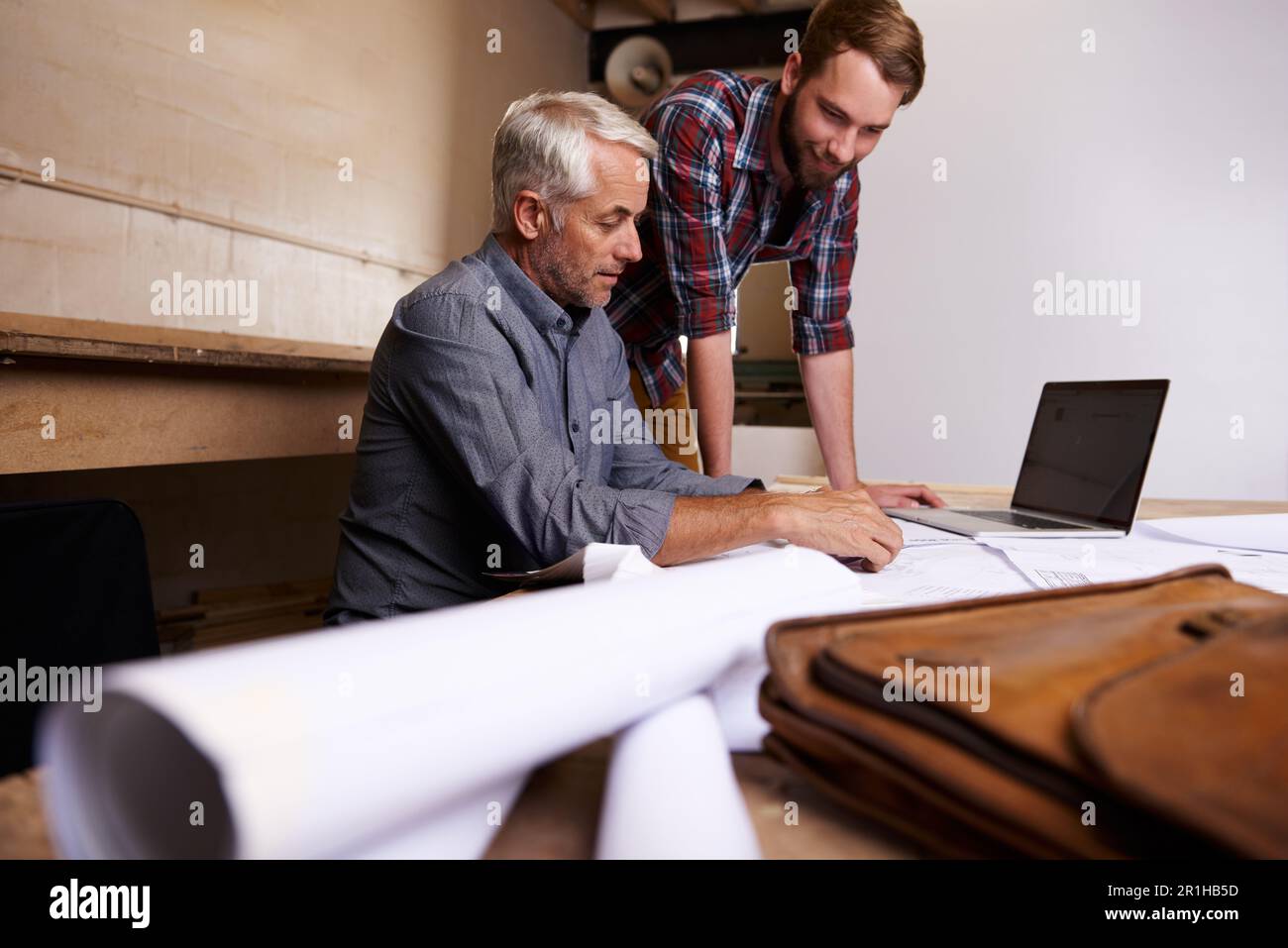 Architects, teamwork and men with blueprint in workshop for building ...