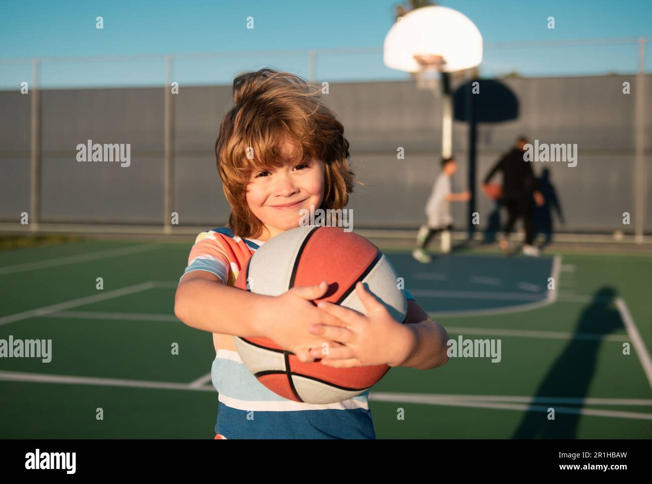 Cute child playing basketball. Sport for kids Stock Photo - Alamy