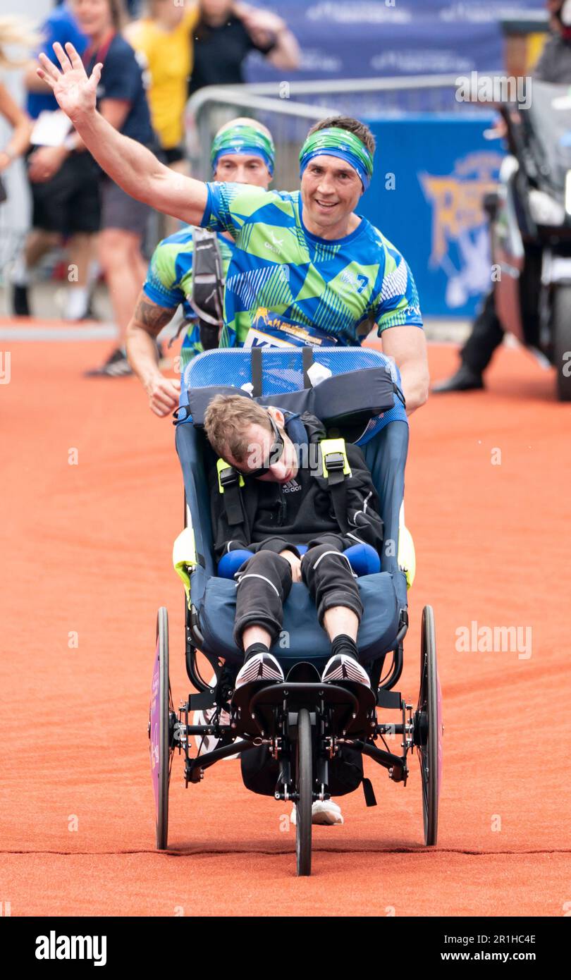 Rob Burrow and Kevin Sinfield approach the finish line of the 2023 Rob ...