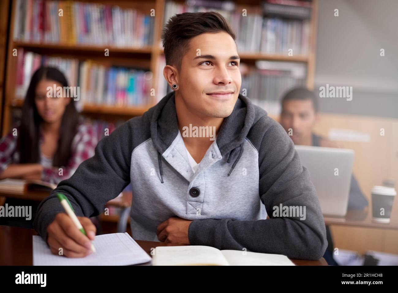 Study, thinking and notebook with man in library for education ...